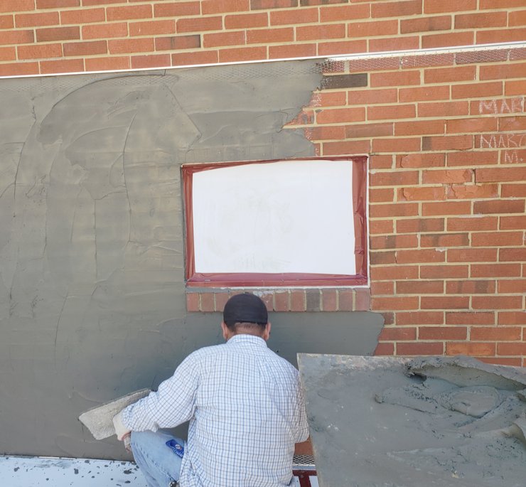Stucco over spalling brick in Manassas, Virginia