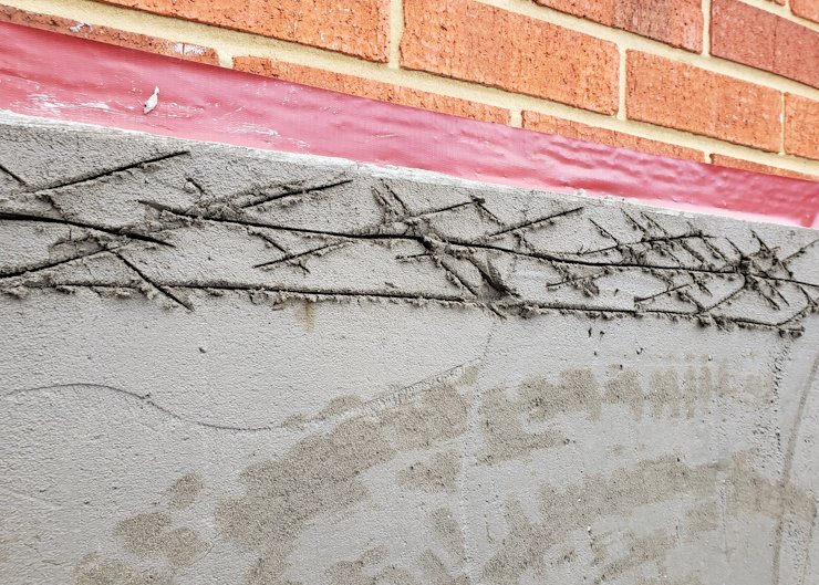 Stucco over spalling brick in Manassas, Virginia